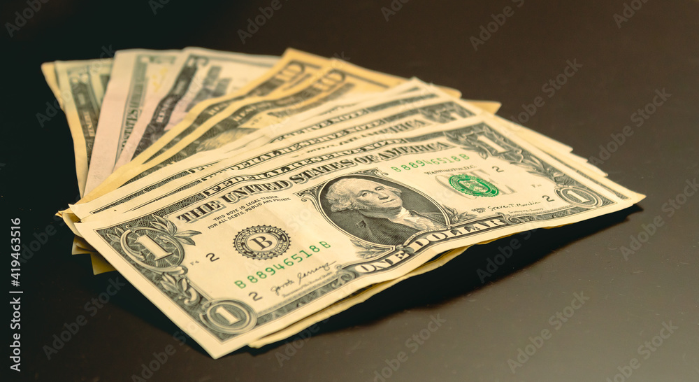 Dollar - USD, Cash money. US dollar bills in fan shape on a dark table ...