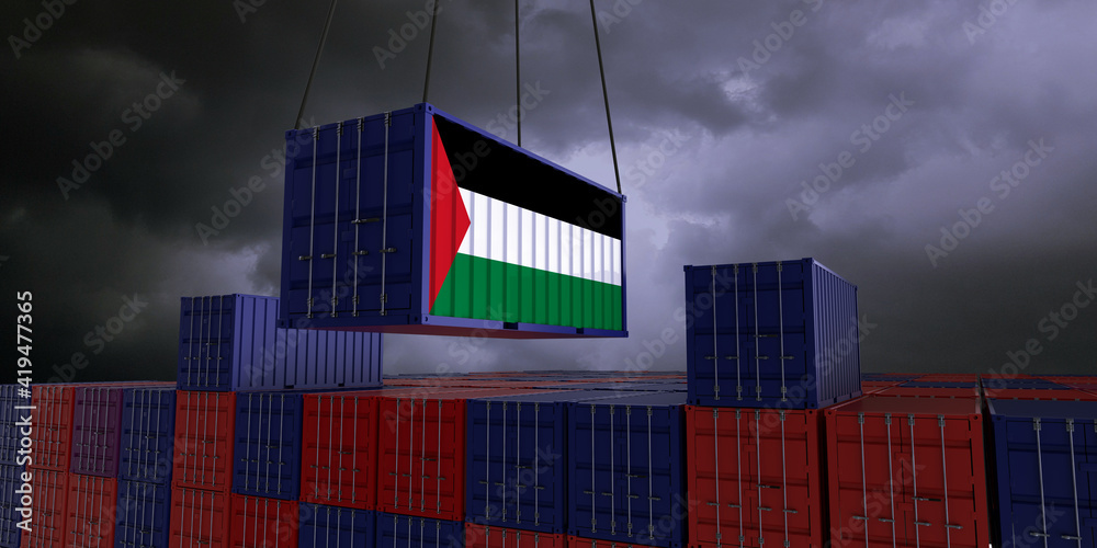 A freight container with the palestinian flag hangs in front of many ...