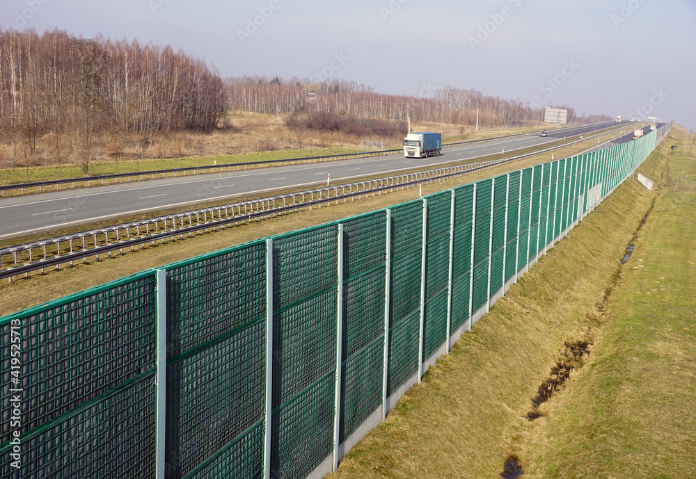 Sound-absorbing barriers separating the highway from the residential ...