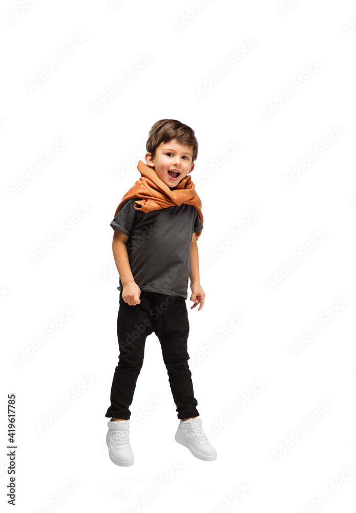 Jumping high. Happy, smiley little caucasian boy isolated on white ...