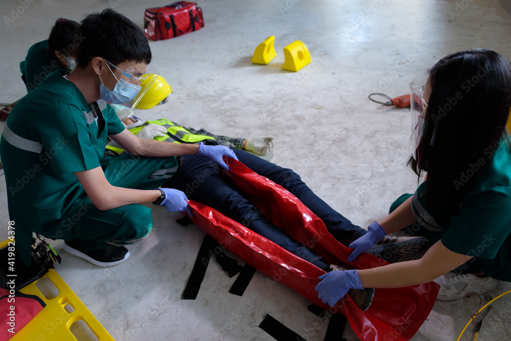 First aid for injuries in work accidents. Using the leg vacuum splint ...