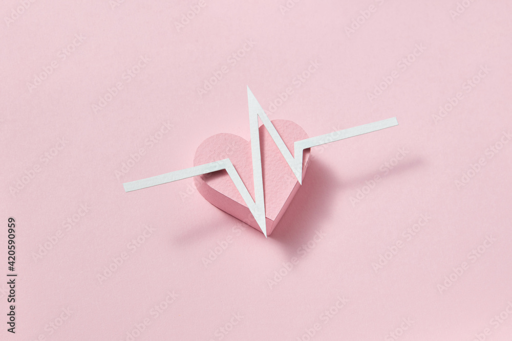 Graphic line of ekg on a papercraft heart. Stock Photo | Adobe Stock