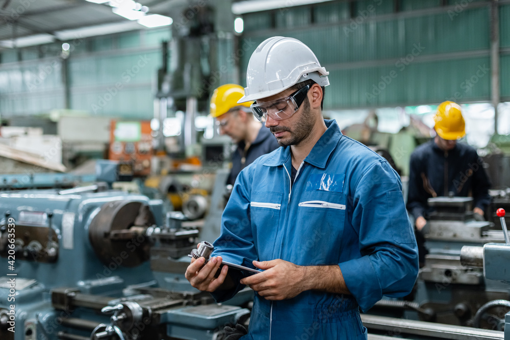 Teamwork professional engineer working heavy industry in factory ...