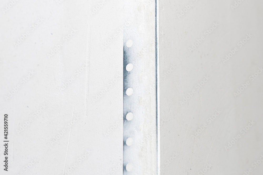 Perforated metal profile corner to protect the plaster from cracking ...