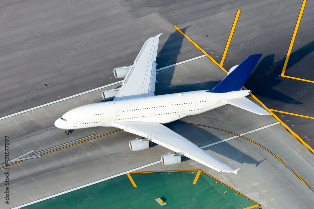 Aerial view of white unidentified aircraft in an international airport ...