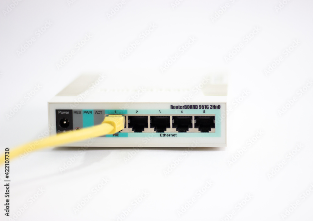 Network cable is plugged into router. Yellow cable in Wi-Fi router ...