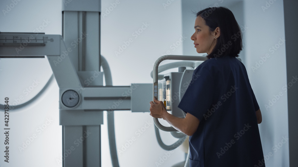 Hospital Radiology Room: Female Latin Nurse Adjusts X-Ray Machine ...