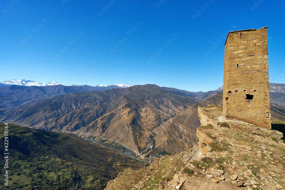 Ancient guard tower on the edge of a rock at Goor village in Dagestan ...