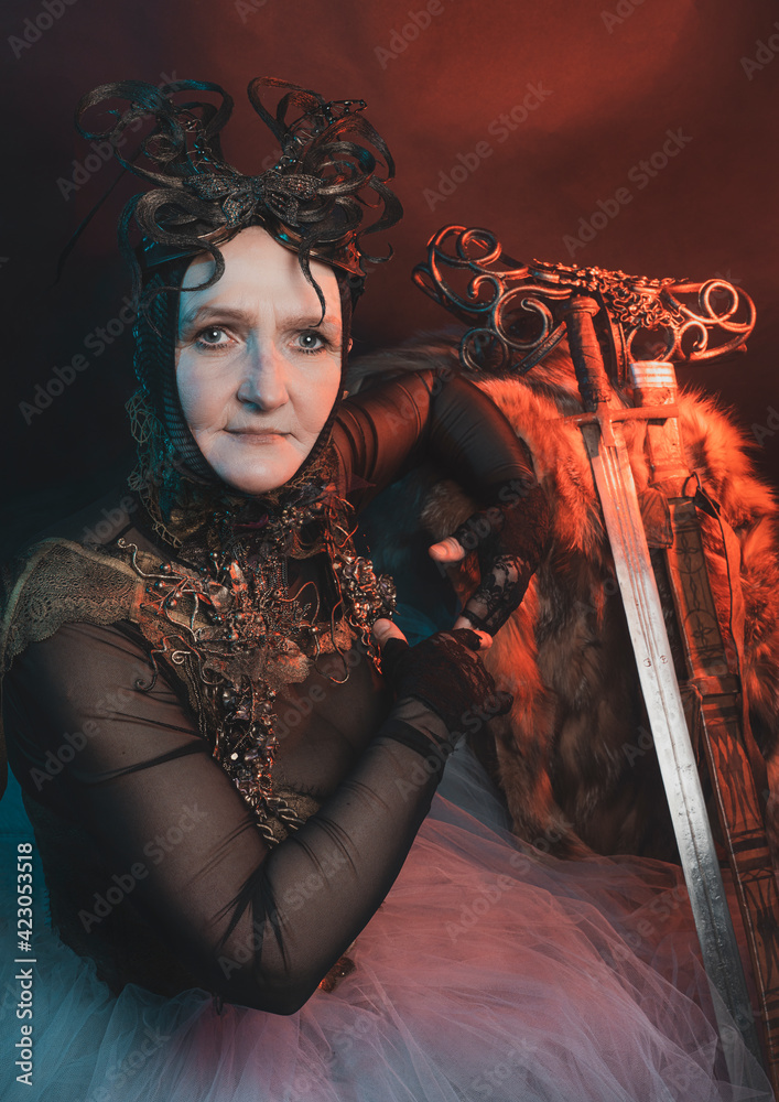 Fabulous creature, queen, sorceress, in a colorful suit and sword ...