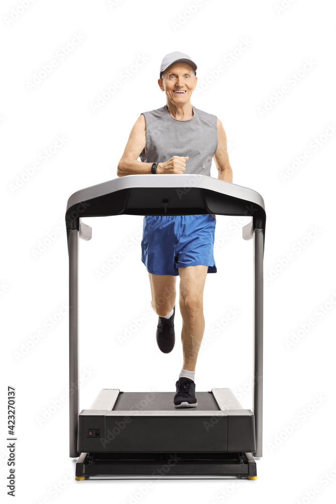 Full length portrait of a smiling elderly man running on a treadmill ...