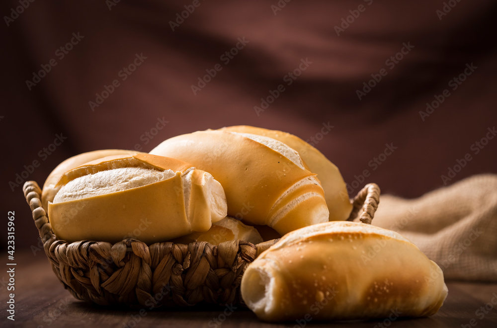 Basket with French breads. French bread, traditional brazilian bread ...