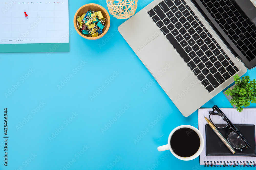 Top view desk and computer or laptop with a pen and business calendar ...