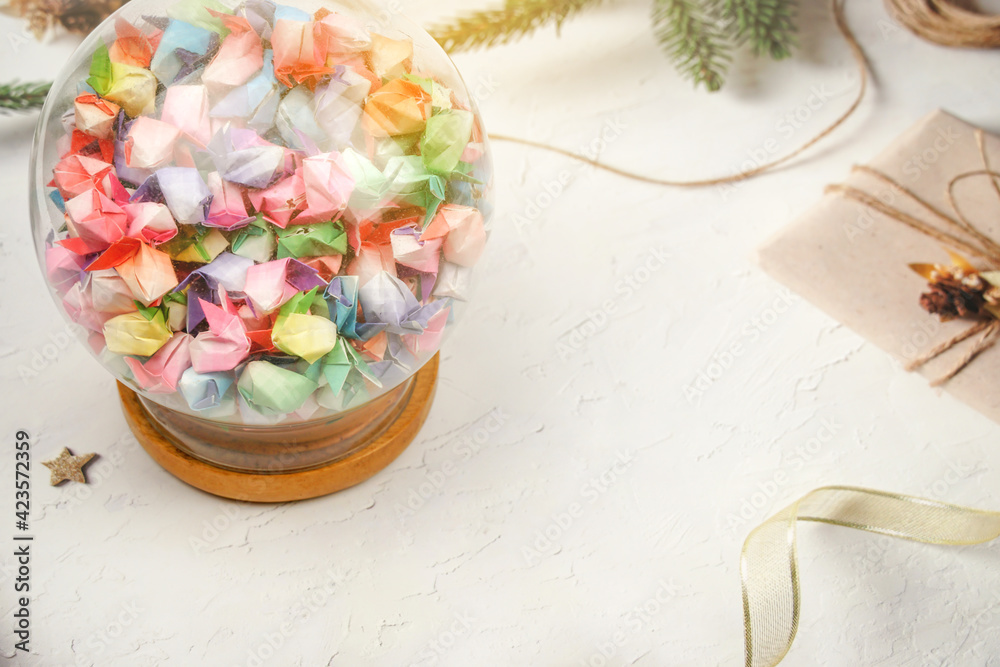 Fold paper of different colors in a glass jar origami in the jar. gift ...