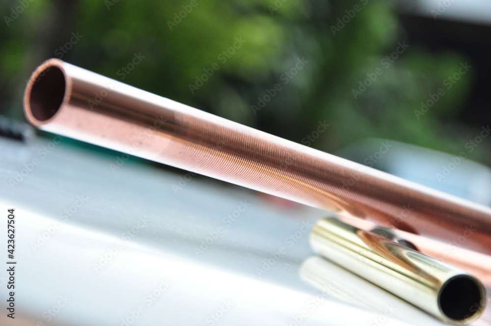 Copper pipe, the pipe is threaded around. Stock Photo | Adobe Stock