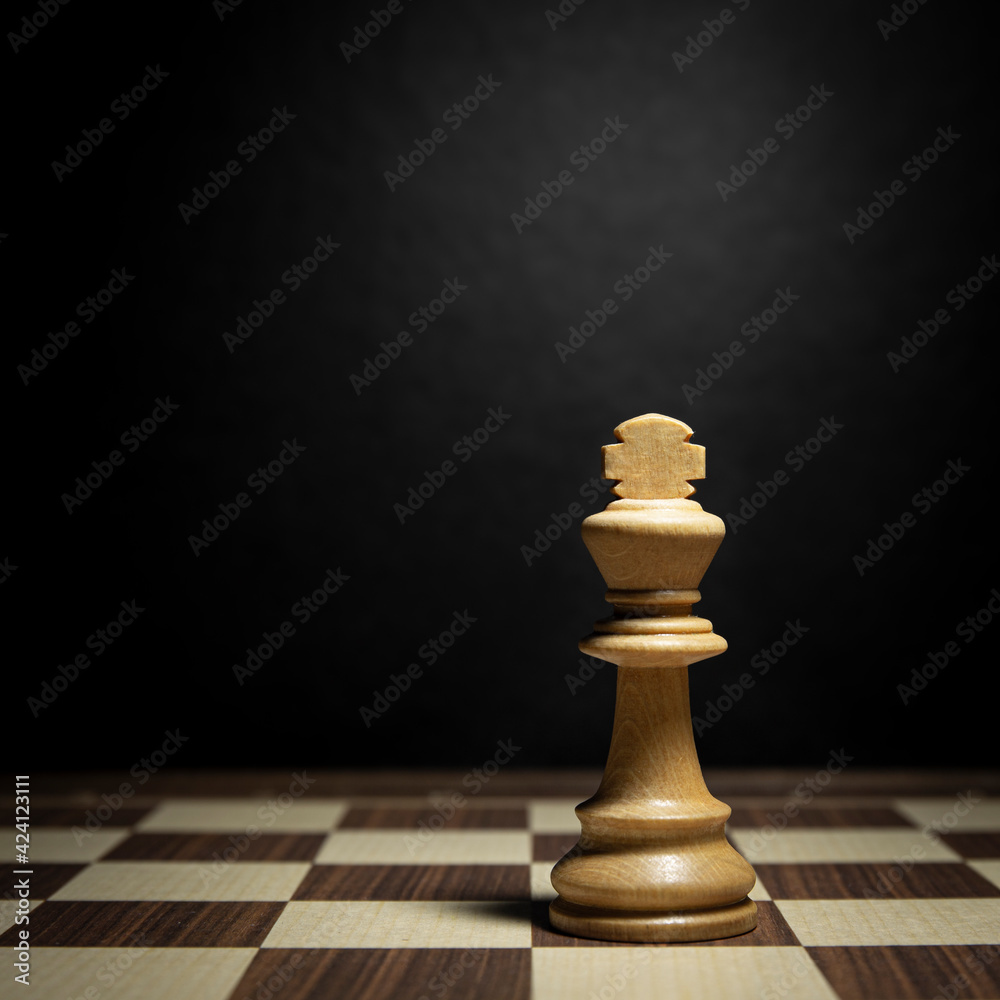 King alone on the chessboard. Concept picture of chess piece taken in ...