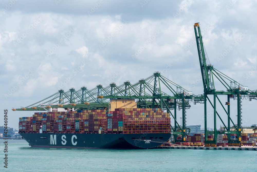 Foto de Stock Container ship "MSC Samar" berthed at cargo terminal in port of Singapore. Cargo ...