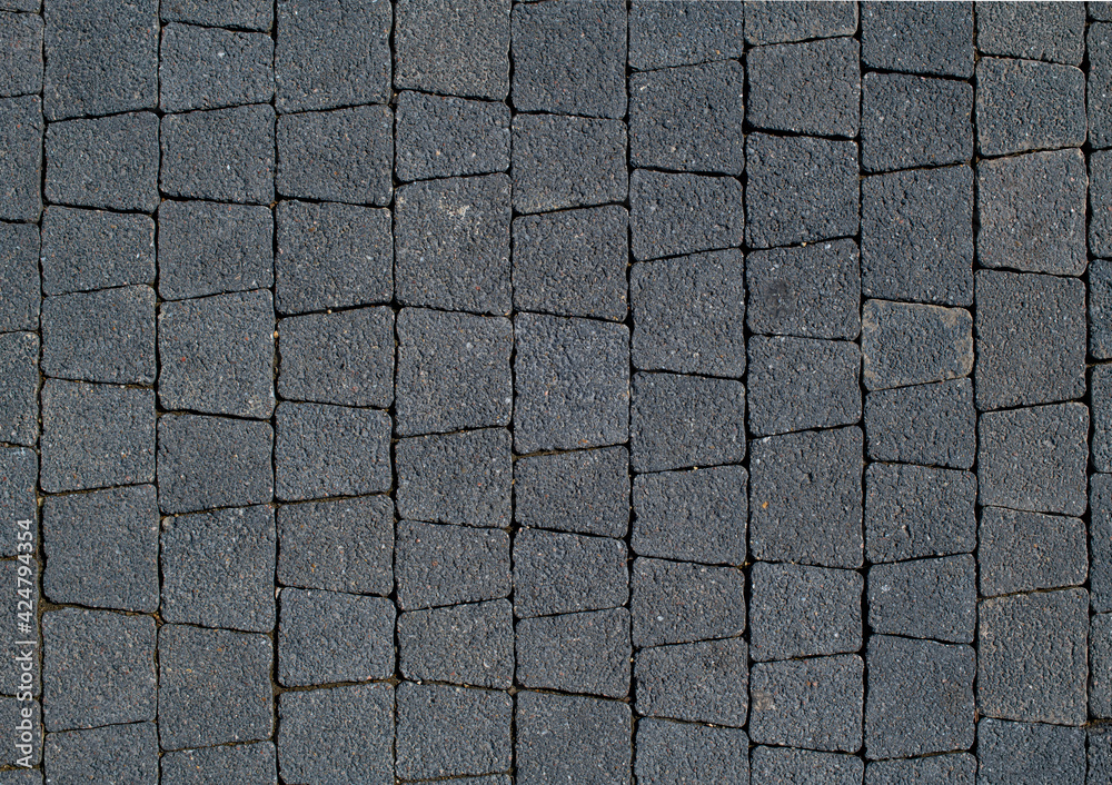 Trapeze-shaped black paving tile Stock Photo | Adobe Stock