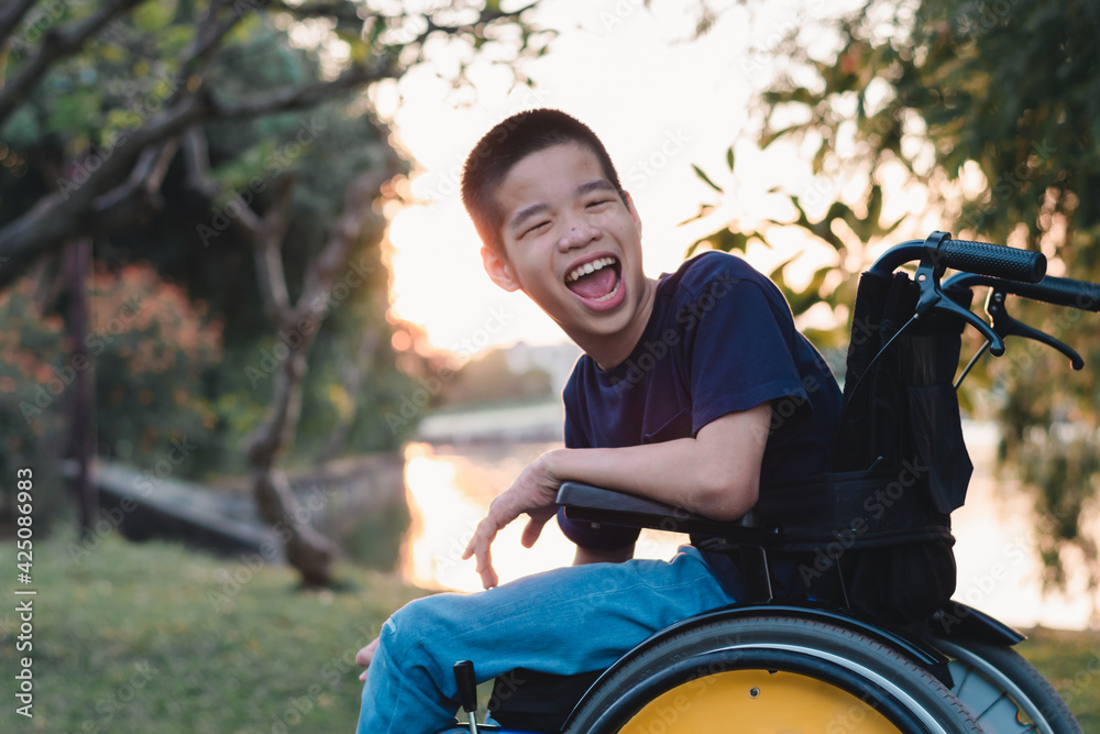 Asian special child on wheelchair is smiling face as happiness on the ...