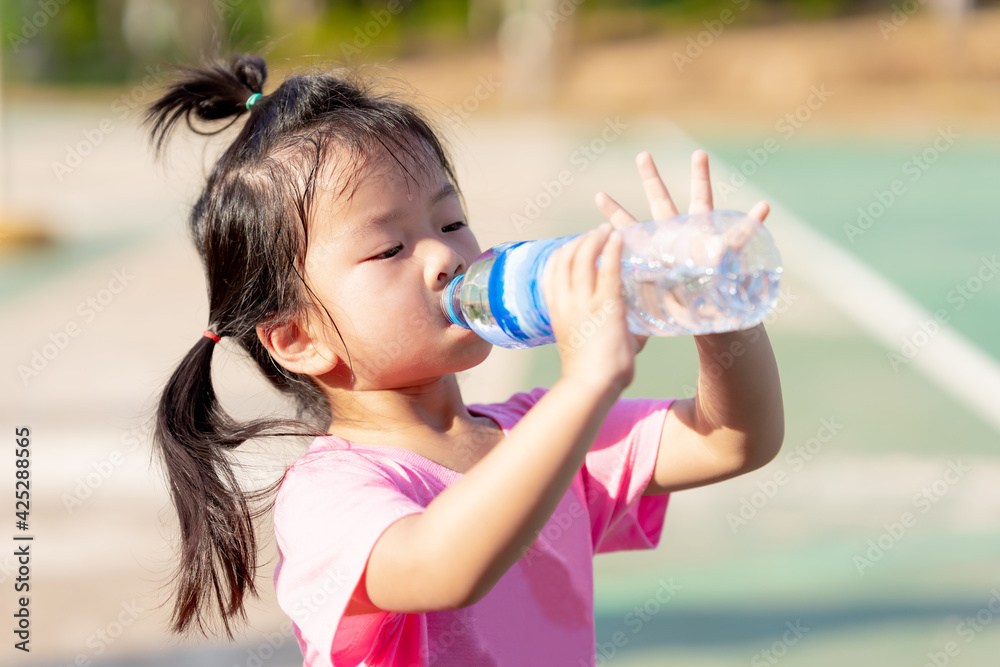 Asian child are thirsty. Kid are tired from playing in hot weather ...