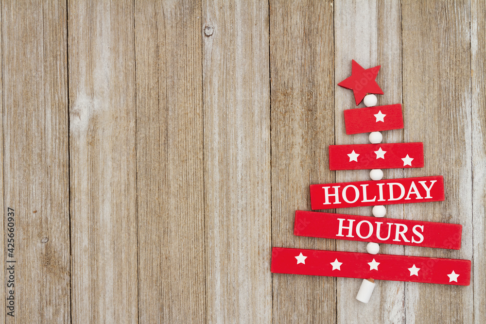 Holiday Hours sign on weathered wood Stock Photo | Adobe Stock