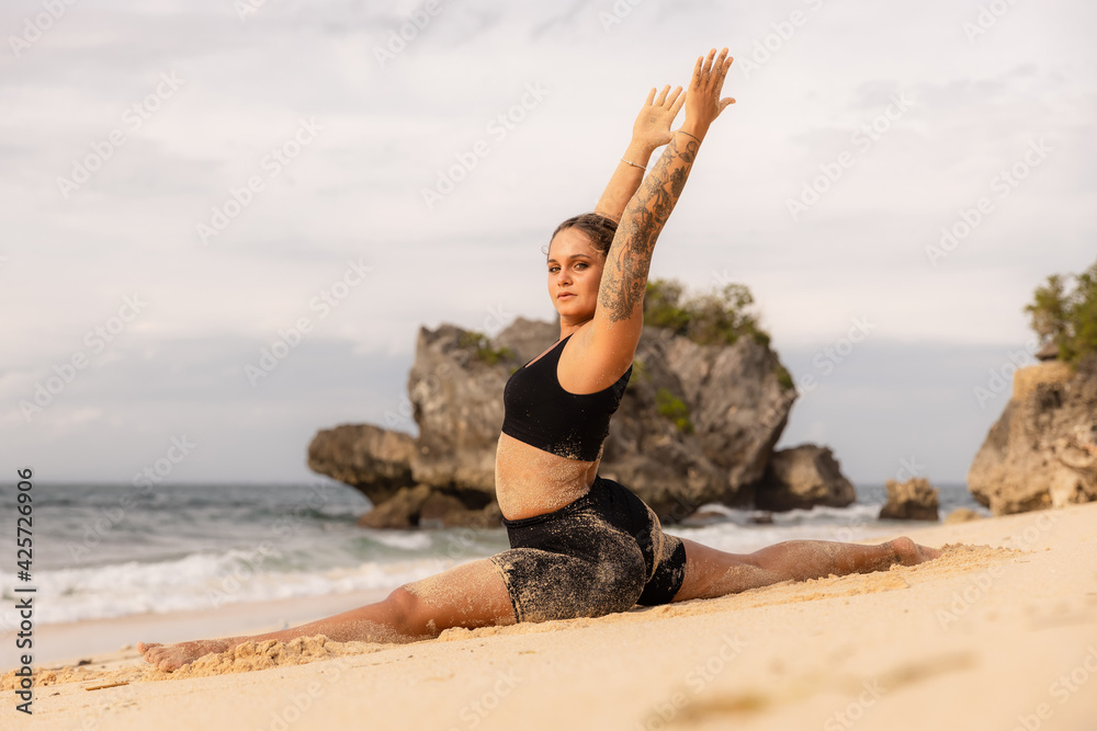 Yoga practice. Beautiful Caucasian woman practicing Hanumanasana ...