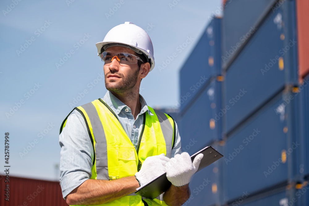 Logistics engineer working with checking list of shipping container in ...