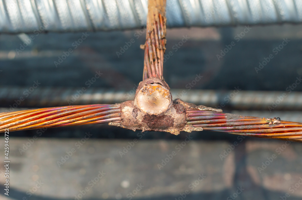 Photo Stock Welding copper ground wire on ground rod.Welding copper ...