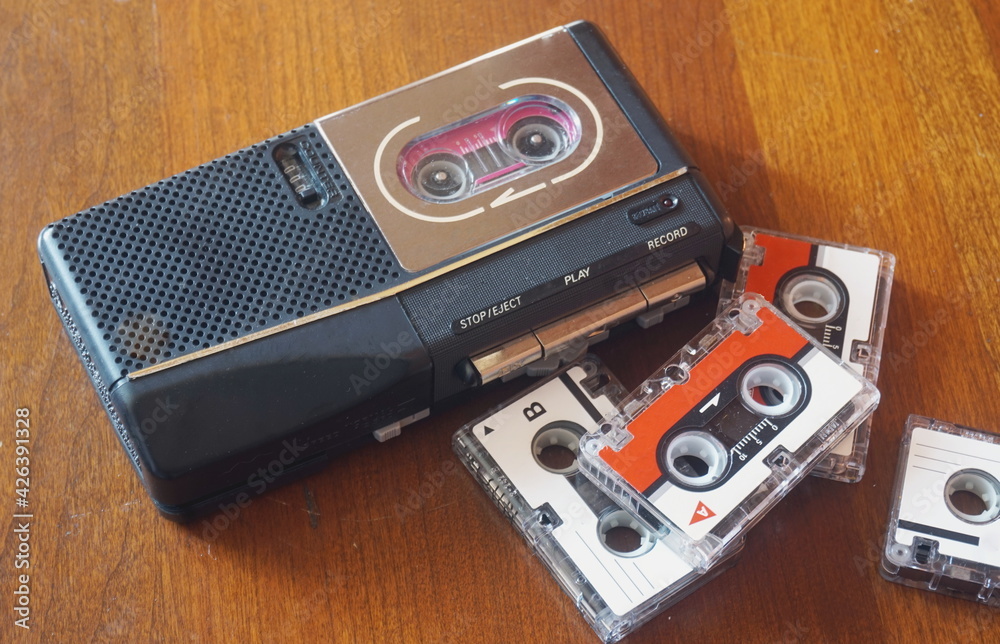 Mini Tape Recorder with Mini Cassettes on Maple Wood Background Stock ...
