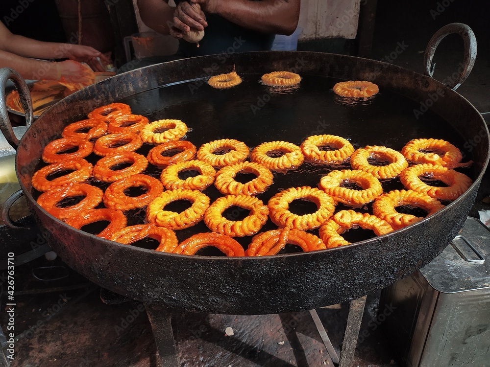 Stock-Foto „Imarti or Amriti is a sweet from India. It is made by deep ...