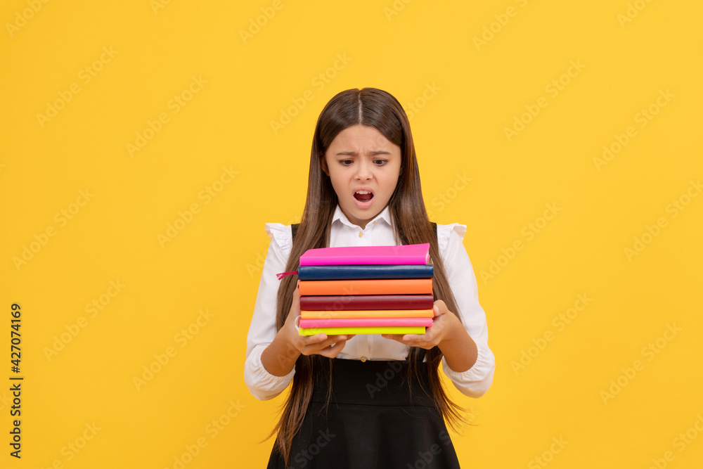 shocked teen girl in school uniform hold book stack, prepare to exam Stock Photo | Adobe Stock