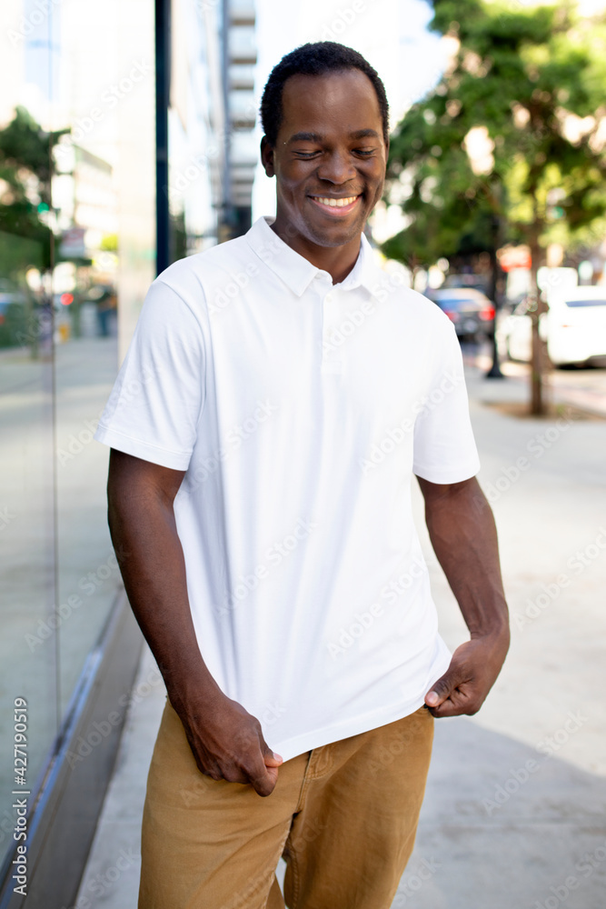 White polo shirt casual apparel outdoor shoot Stock Photo | Adobe Stock