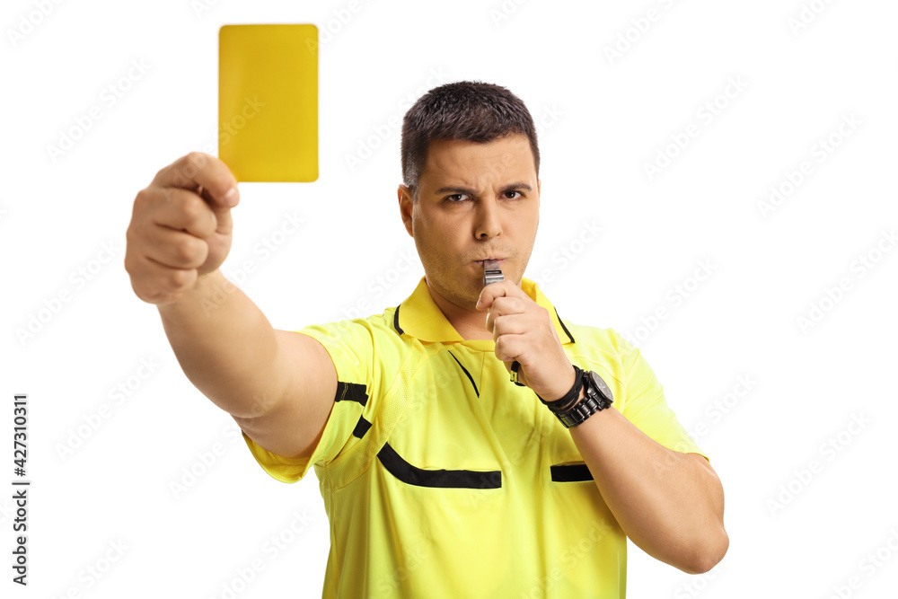 Football referee blowing a whistle and showing a yellow card Stock ...