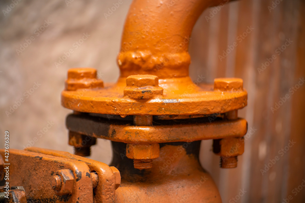 Flange connection is bolted on a metal painted pipe. Flange on the pipe ...