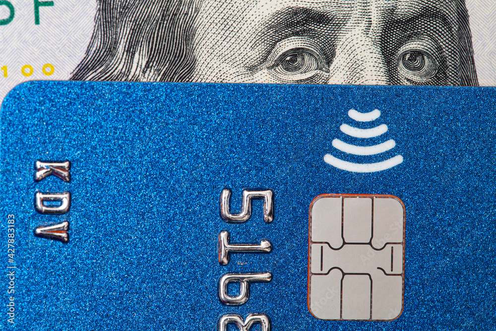 Debit card and US 100 dollar banknote Stock Photo | Adobe Stock