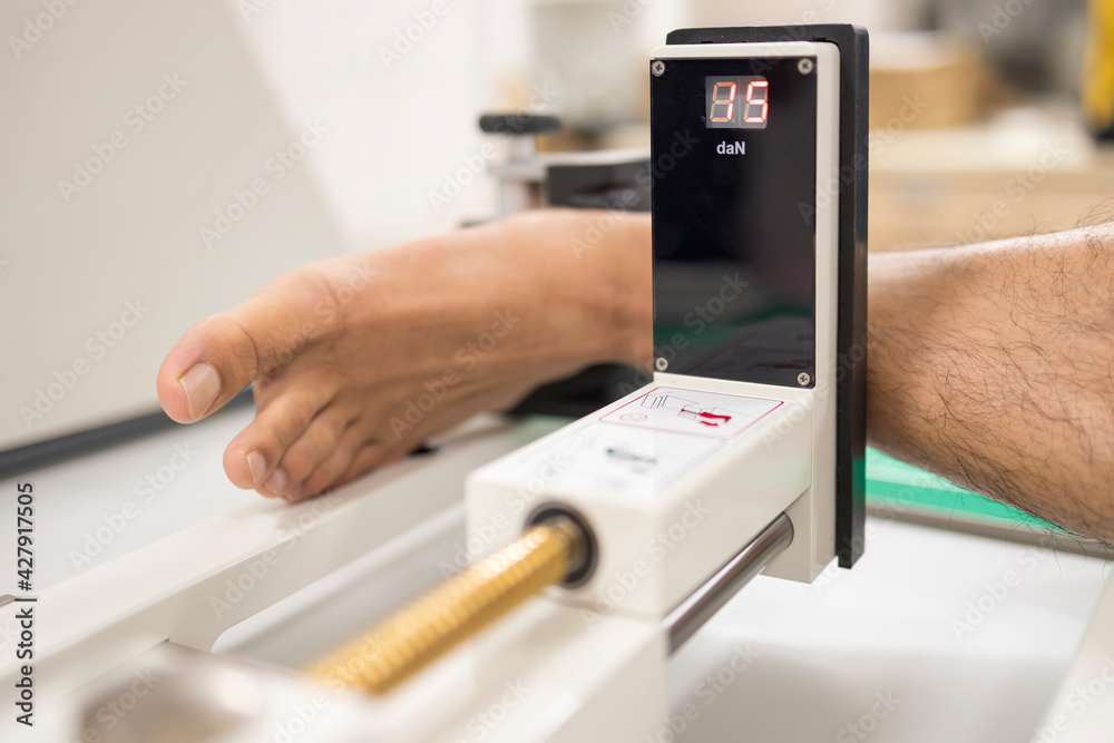 Doctor using stress test in ankle instability patient with chronic ...