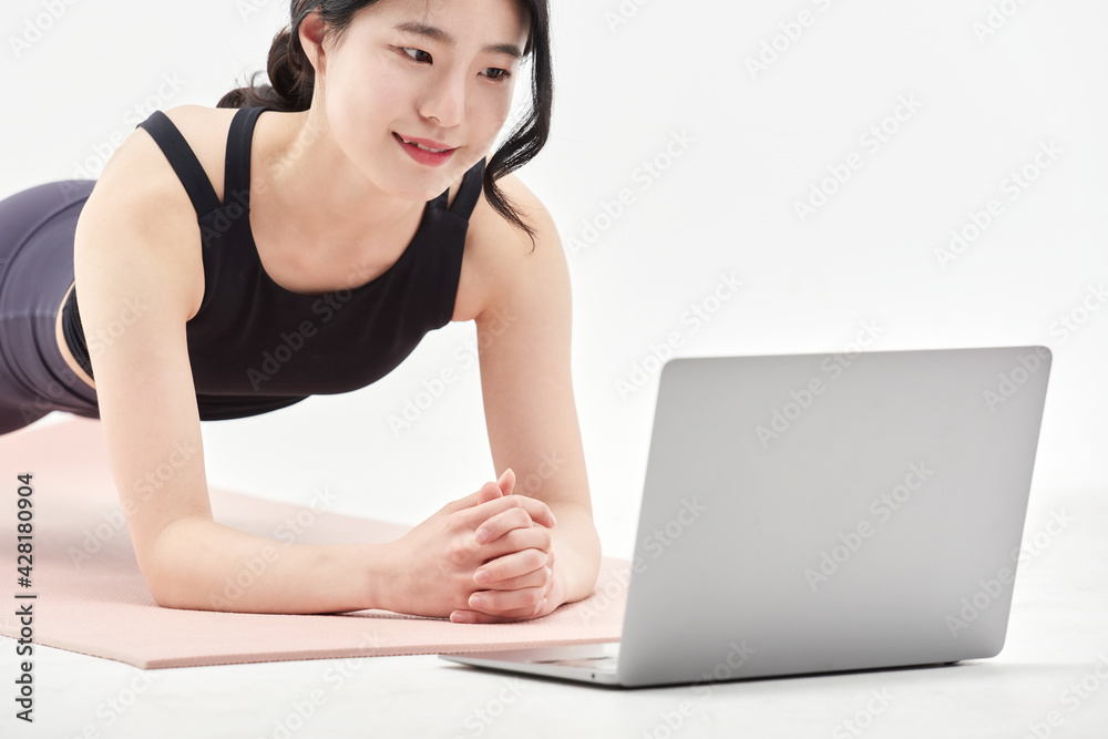 Asia korean girl long haired beautiful pilates or yoga athlete does a ...