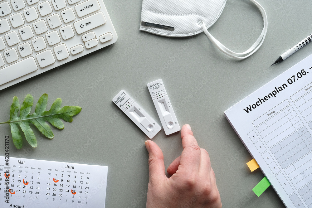 Foto de Stock Back to school with express coronavirus tests. Hand with ...