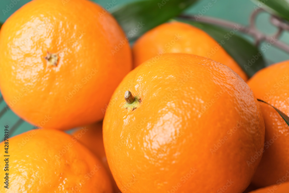 Basket with sweet tangerines on color background, closeup Stock Photo ...