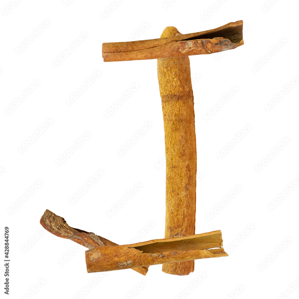 Cinnamon font. Letter J is made from pieces of cinnamon on white ...