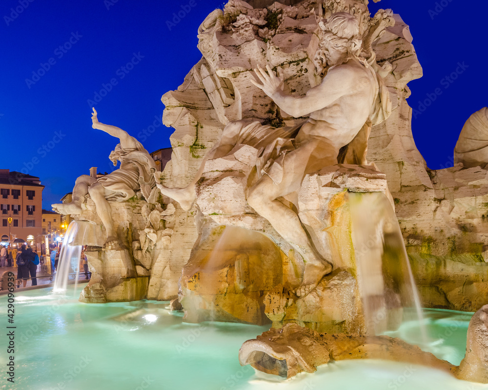 Illuminated at night the fontana del Moro (the Moor Fountain) on Piazza ...