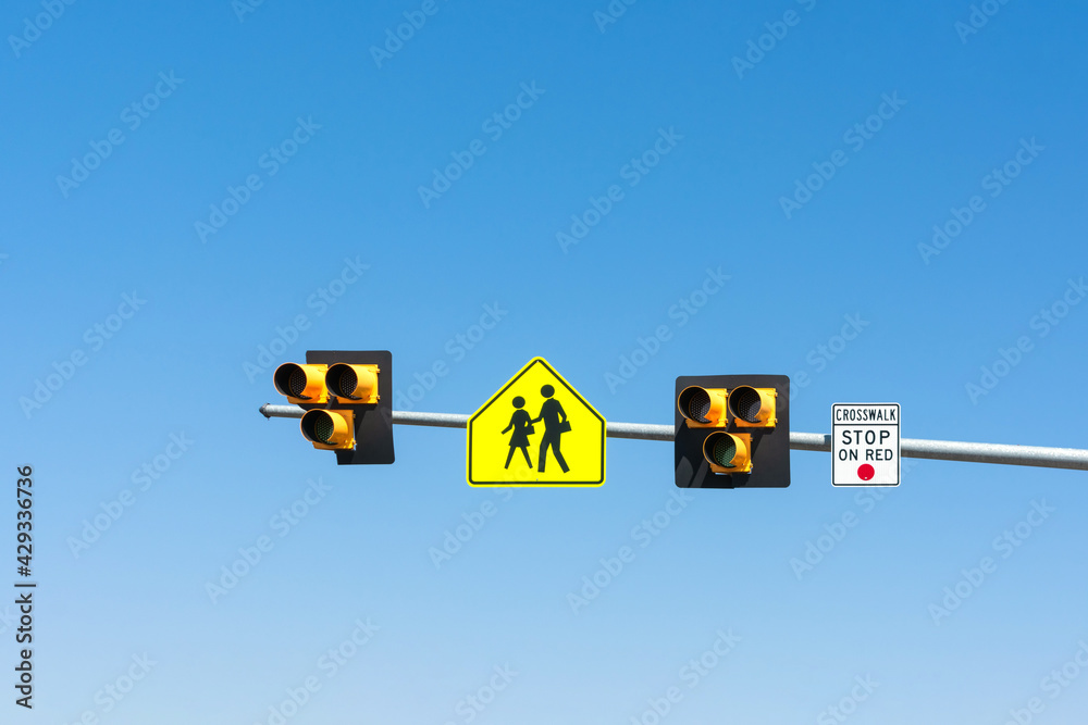 Fotografie Overhead high visibility crosswalk sign. The traffic control ...