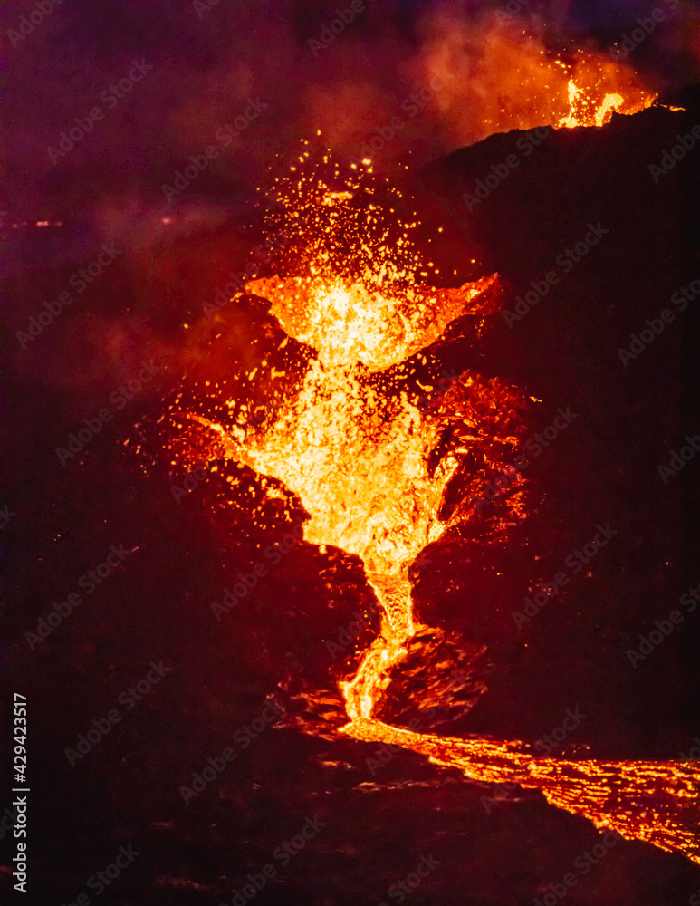 Lava exploding in from the volcano, red fire erupting from the crater ...