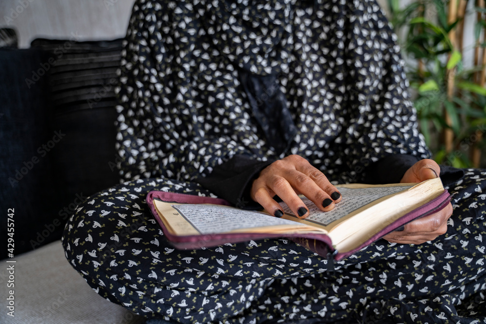 Black Muslim Woman studying and reading quran Stock Photo | Adobe Stock