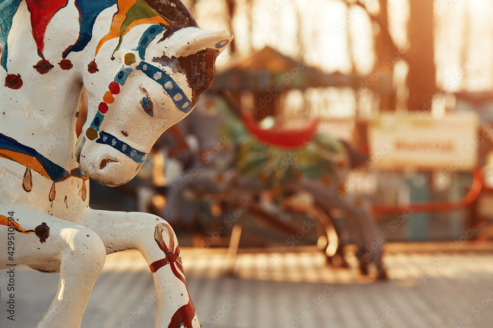 Stock-Foto „Soviet abandoned amusement park. Vintage carousel horses. A ...