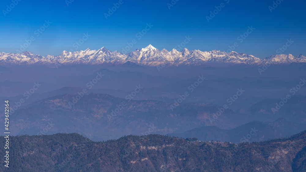Panoramic view of the snow covered Himalayan mountain ranges and Nanda ...
