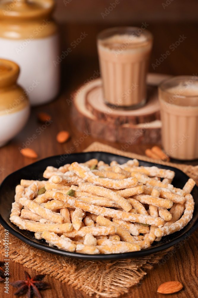 Madhura Seva Kerala fried snacks sweet food and Indian milk tea masala ...