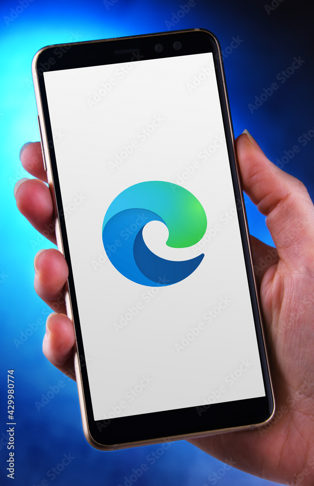 Hand holding smartphone displaying logo of Microsoft Edge Stock Photo ...