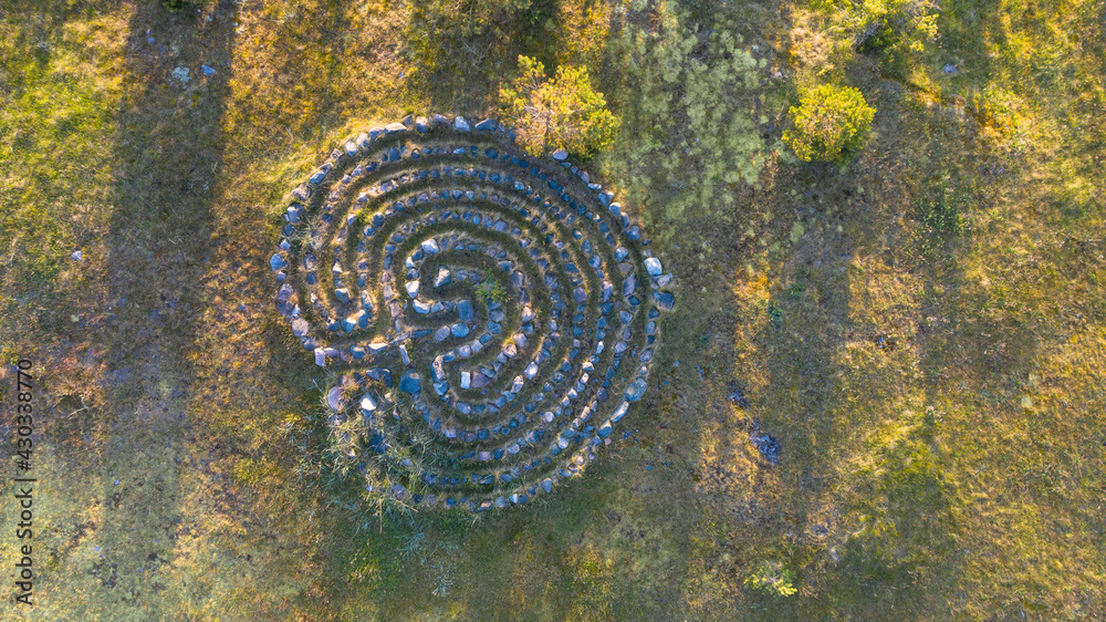 Aerial top down view t othe man made circle shape maze made from small ...