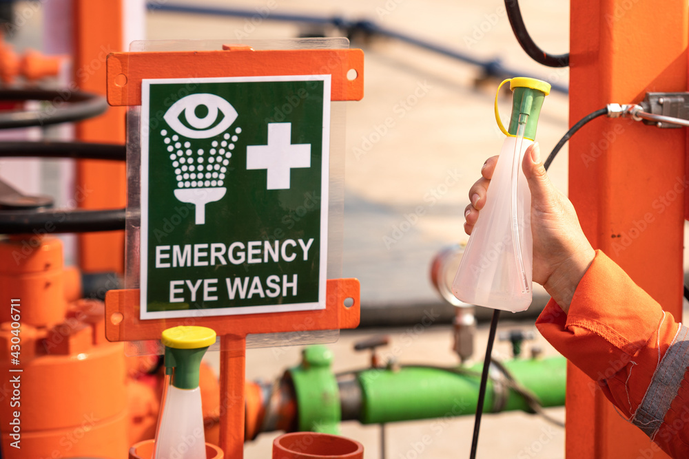 Clean water bottle at emergency eye wash station, using in case of ...