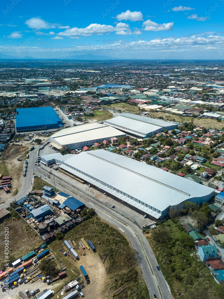 Aerial view of large warehouses and factories north of Metro Manila, in ...